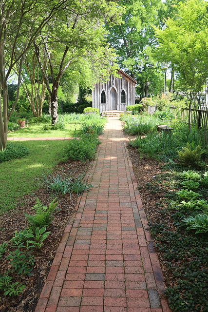 Prattvillage Garden: Brick Pathway to a Rustic Wooden Pavilion